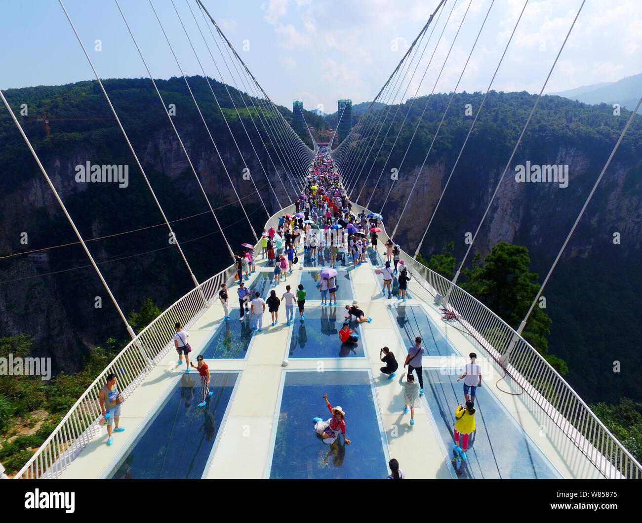 --FILE--Tourists visit the world's longest and highest glass-bottomed ...