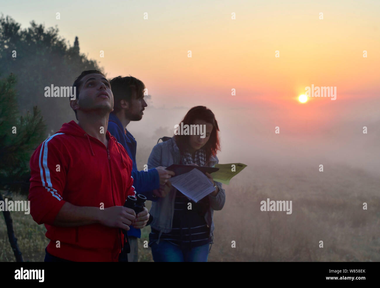 Maltese bird watchers at dawn monitoring migration and hunting during ...