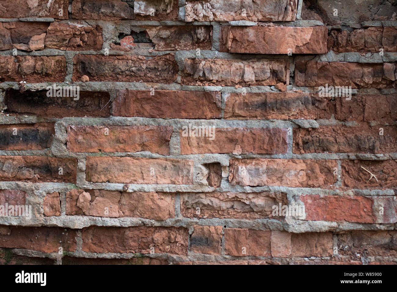 Old weathered rough textured brickwork. broken brickwork with gray ...