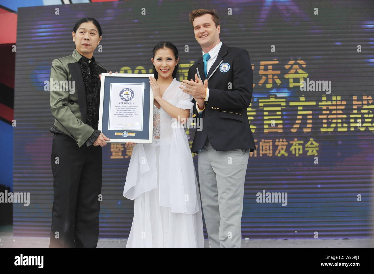 Malaysian magician Avery Chin, left, and his partner Sylvia Lim, center ...
