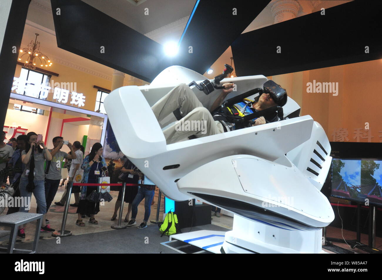 A visitor tries out a Virtual Reality (VR) roller coaster during a ...