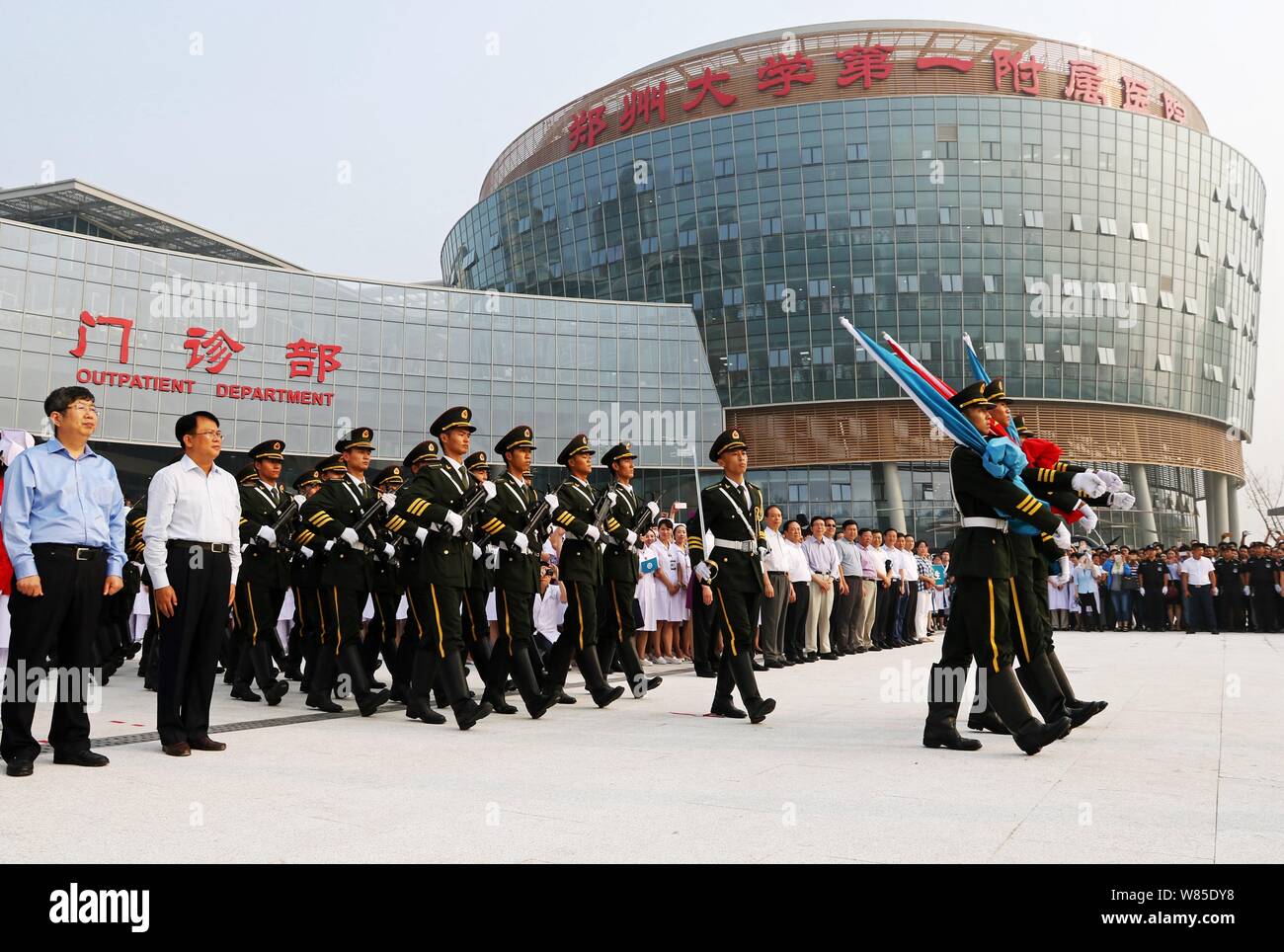 Chinese paramilitary policemen march in front of the First Affiliated ...