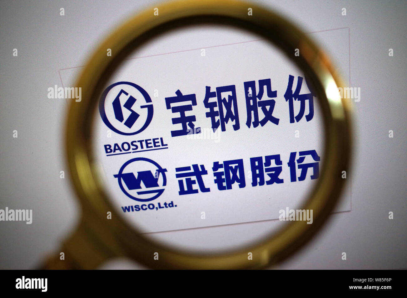 --FILE-- A netizen browses an online image of the logos of Baosteel and ...
