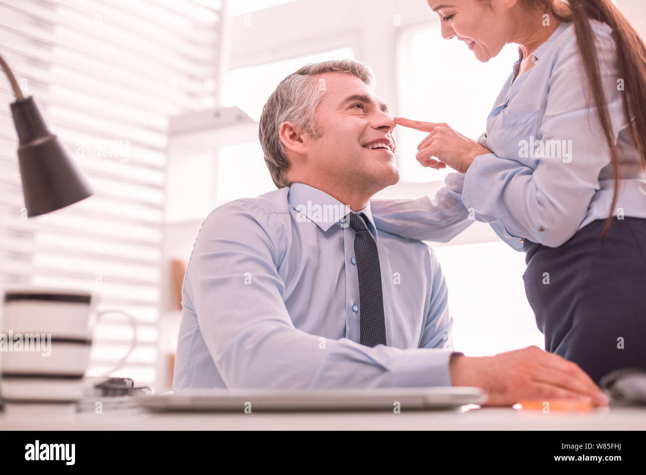 Secretary flirting with her boss at the workplace Stock Photo - Alamy