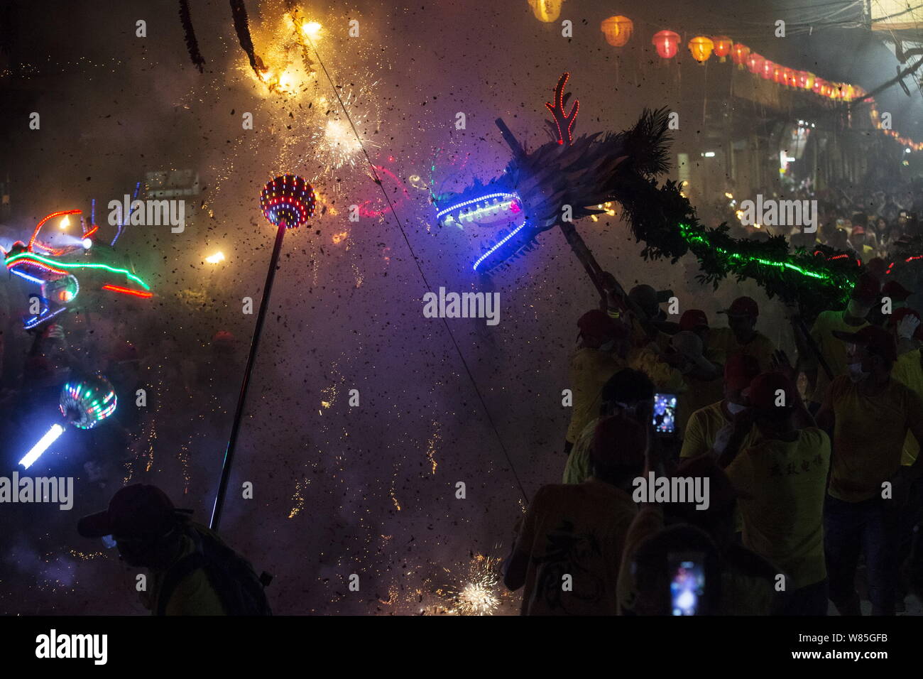Chinese entertainers perform a fire dragon dance to celebrate the Mid ...