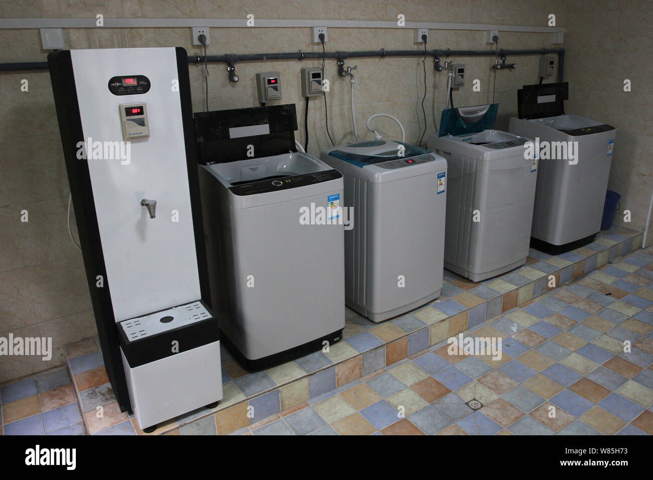 View of the laundry room in a well-equipped dormitory building for ...