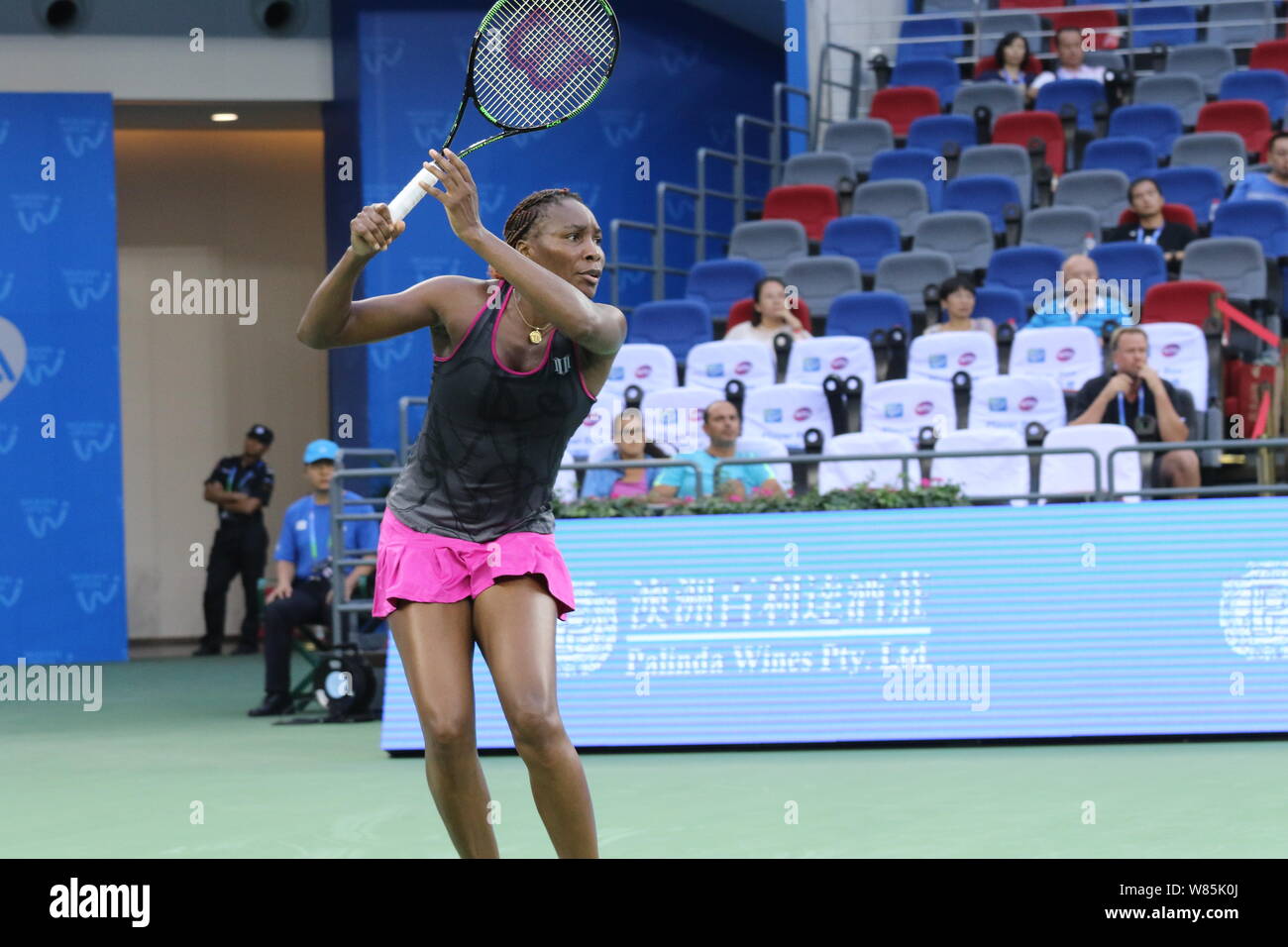 Venus Williams of the United States prepares to return a shot to Yulia ...