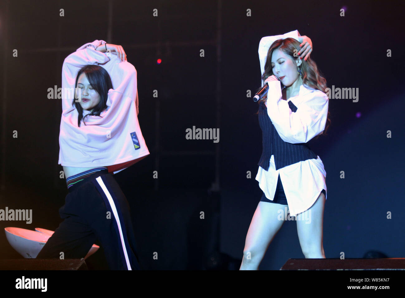 South Korean singer Kim Hyun-a, right, better known by the mononym ...