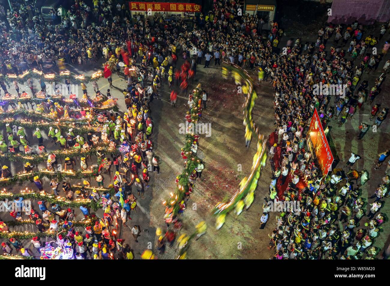 Chinese entertainers perform a fire dragon dance to celebrate the Mid ...