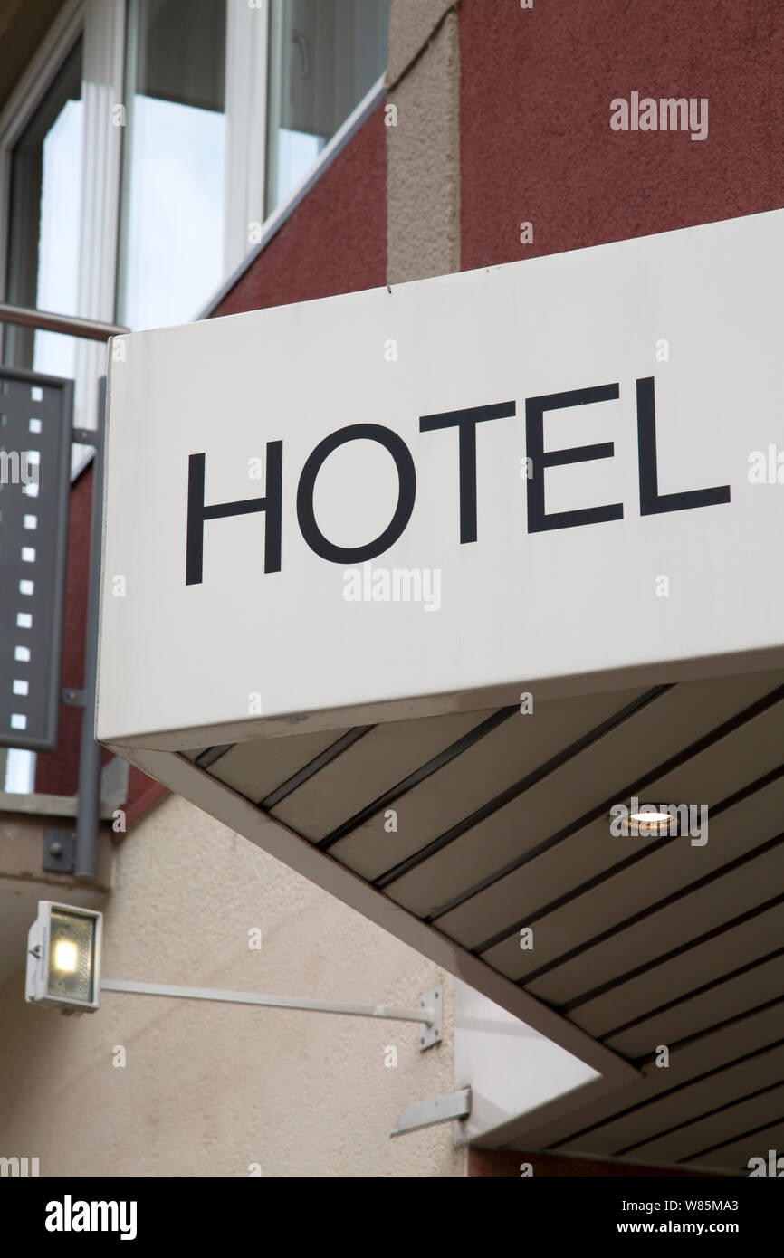 Hotel Sign on Building Facade Stock Photo - Alamy
