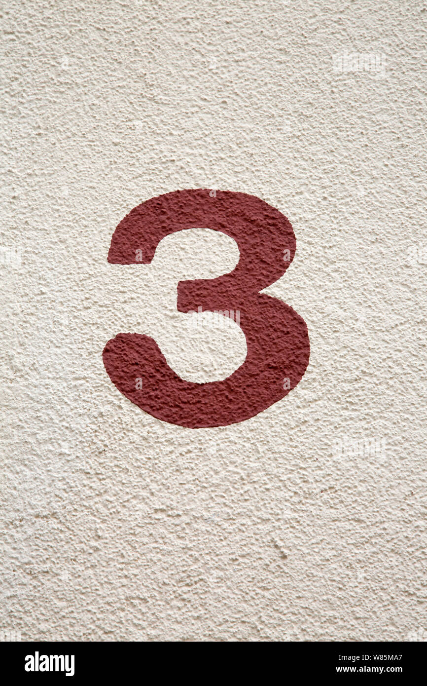 Number Three on Stone Wall Stock Photo - Alamy