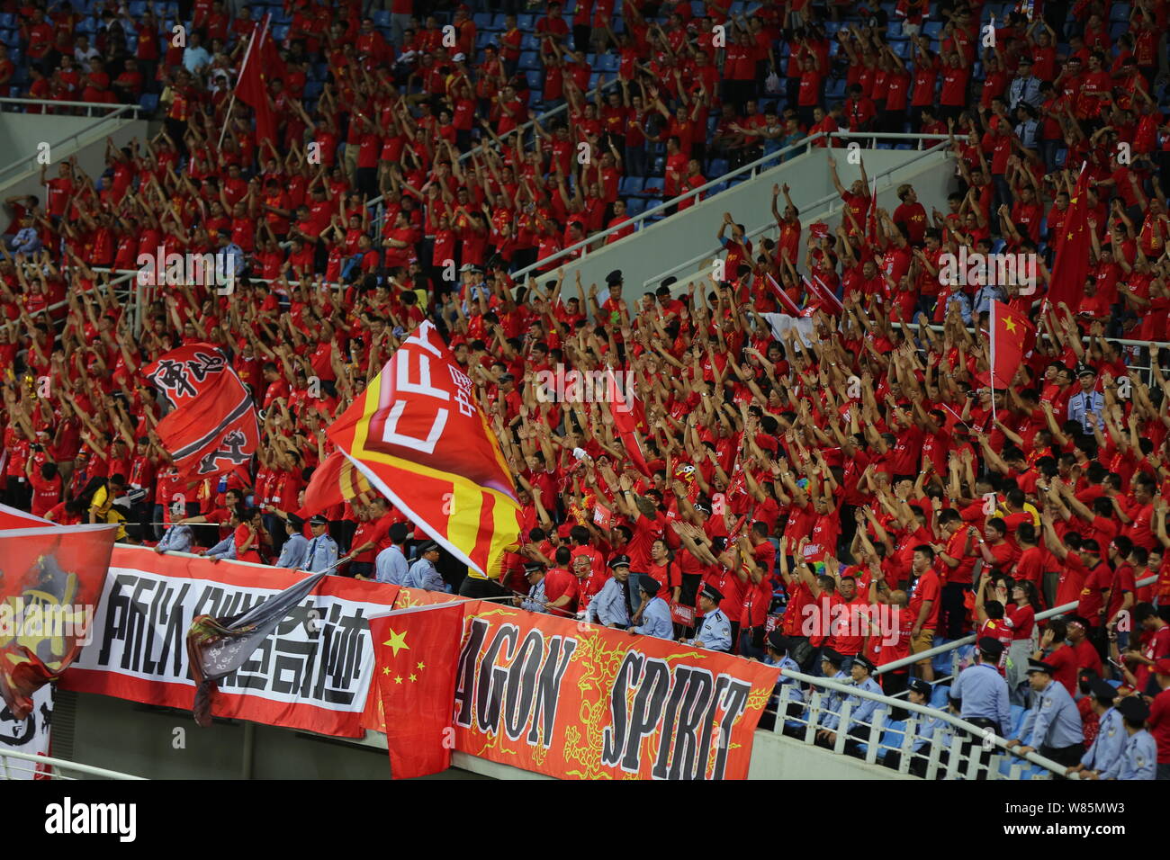 Chinese football fans shout slogans to show support for the China team ...