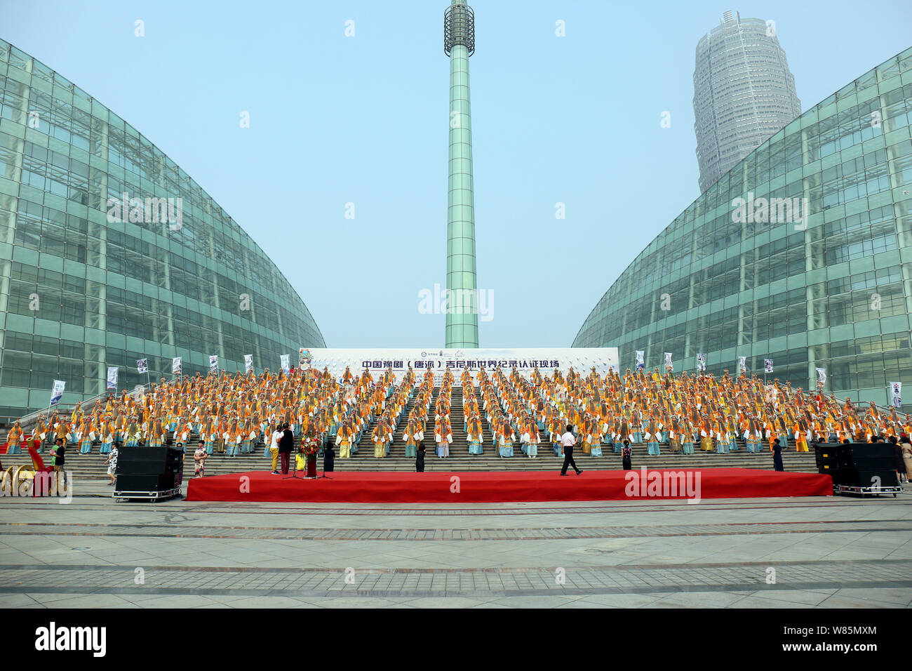 Chinese Opera artists and fans, wearing imperial robes, perform to set ...