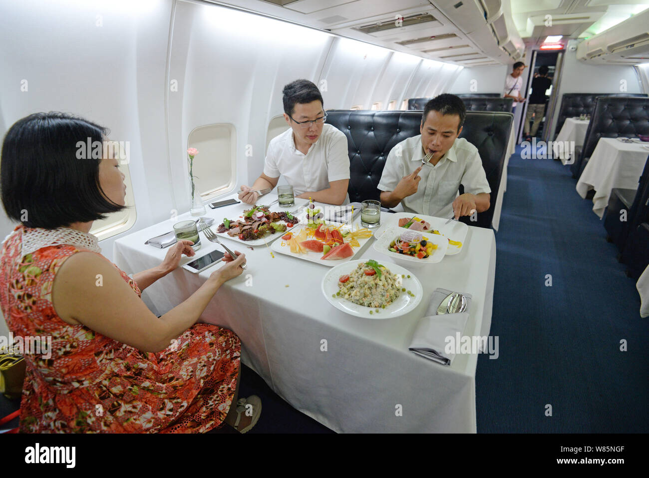 Chinese customers dine on the Boeing 737-400 airplane restaurant "Lily ...