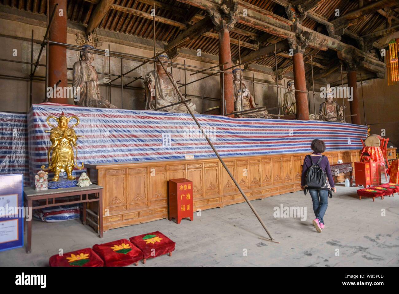 A visitor walks in the lower temple of Guangsheng Temple in Hongdong ...
