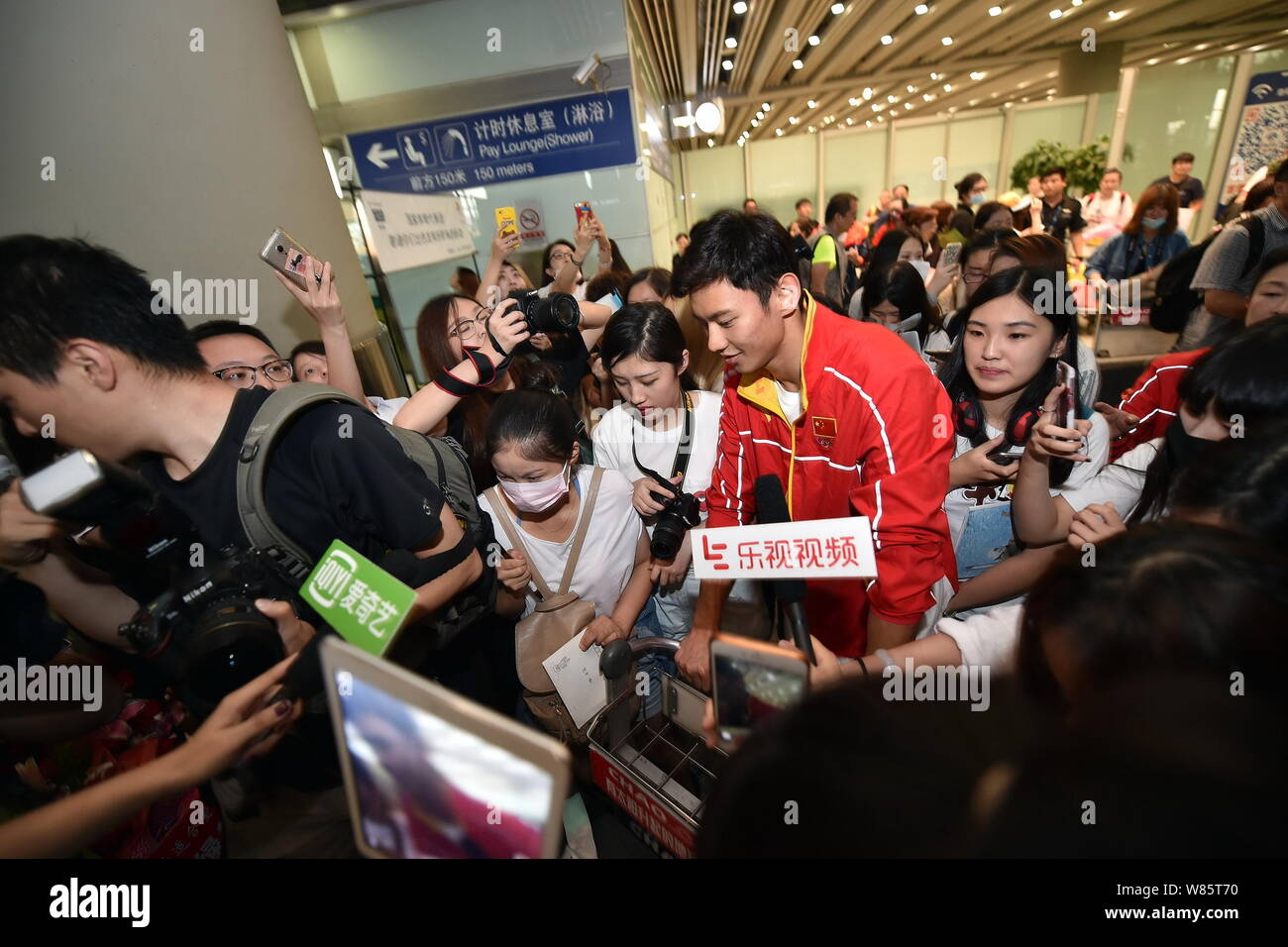 Chinese world swimming champion Ning Zetao is interviewed after coming ...