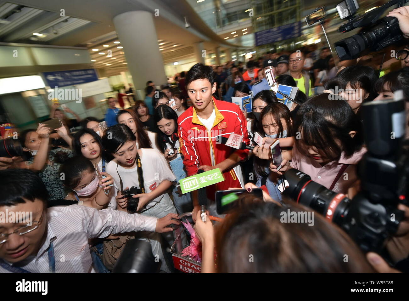 Chinese world swimming champion Ning Zetao is interviewed after coming ...