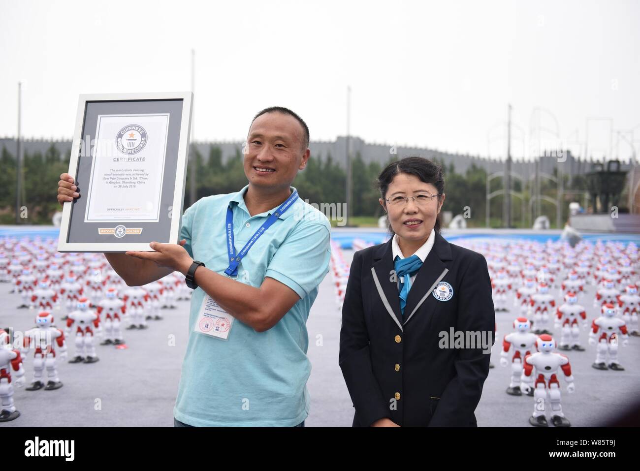 A representative, left, shows the certificate of the new Guinness World ...