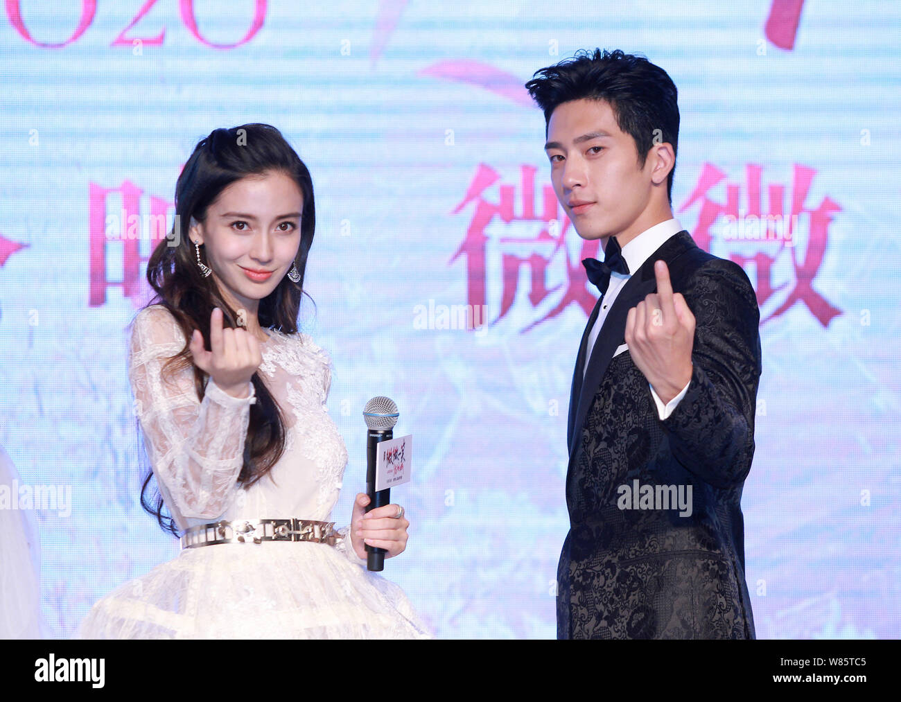 Hong Kong model and actress Angelababy, left, and Chinese actor Jing ...