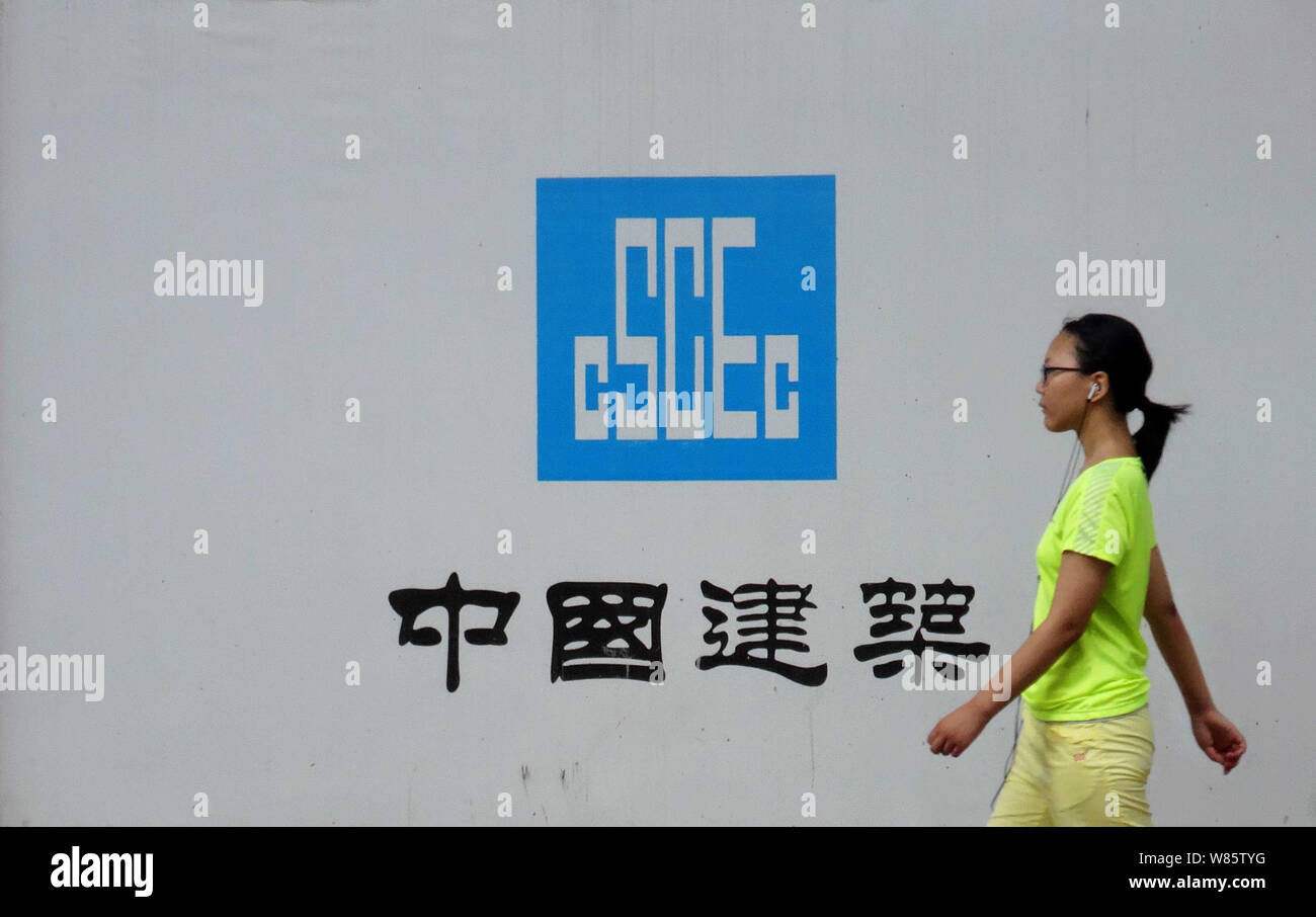 --FILE--A pedestrian walks past a construction site of CSCEC (China ...