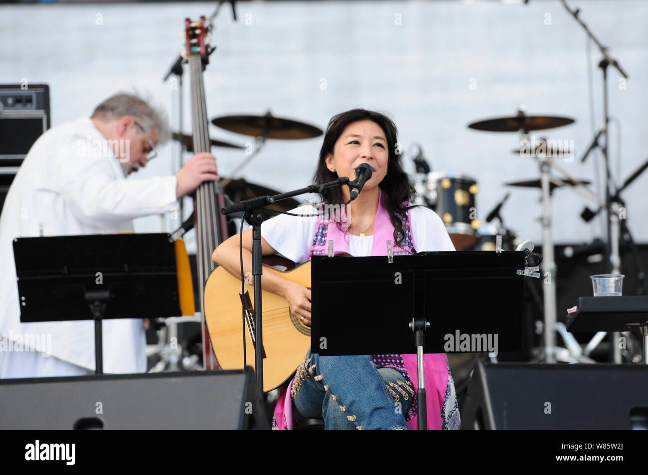Japanese-Brazilian bossa nova singer Lisa Ono, right, performs during ...