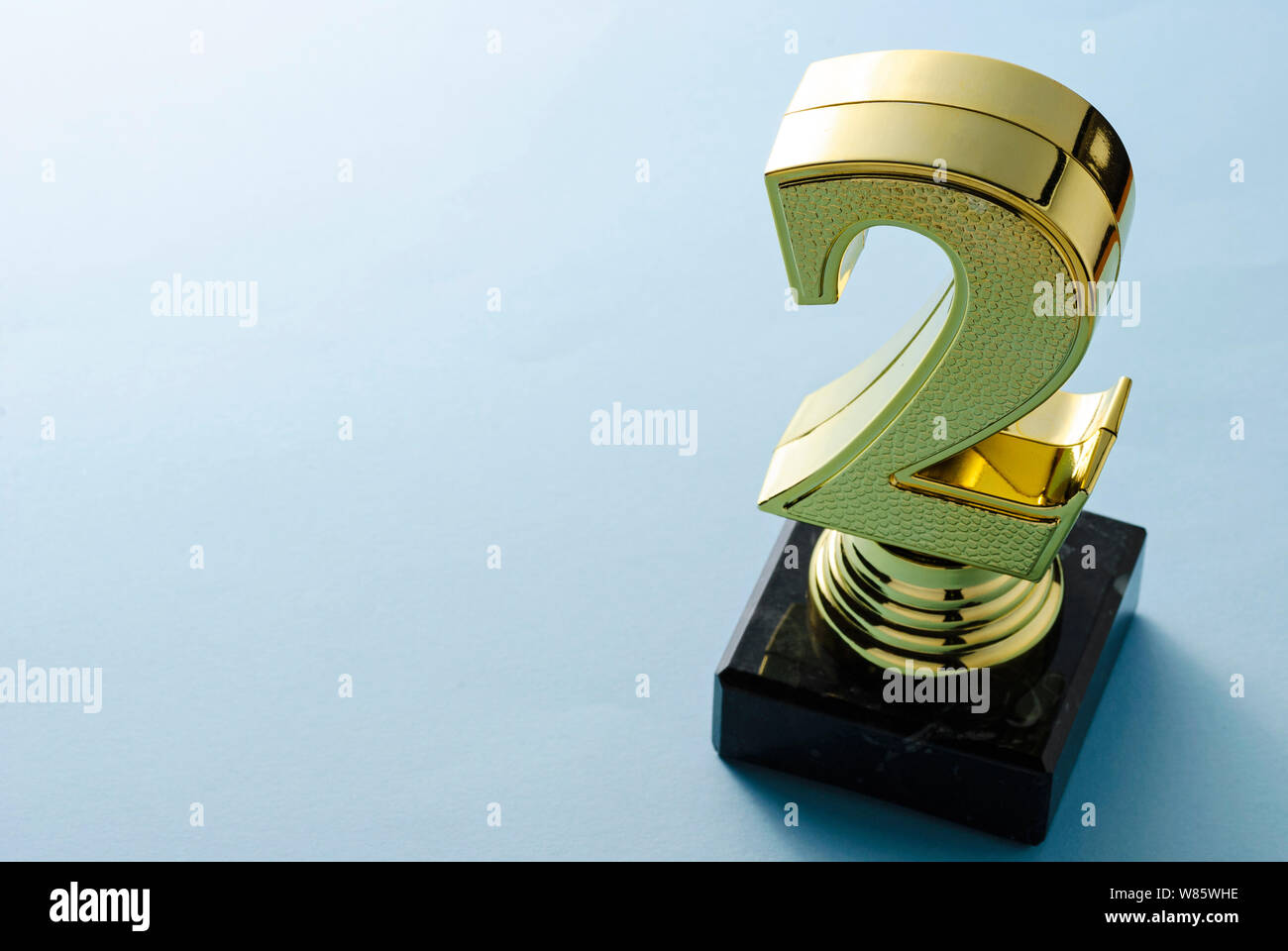Second place runner up gold trophy in the shape of a number two on a ...