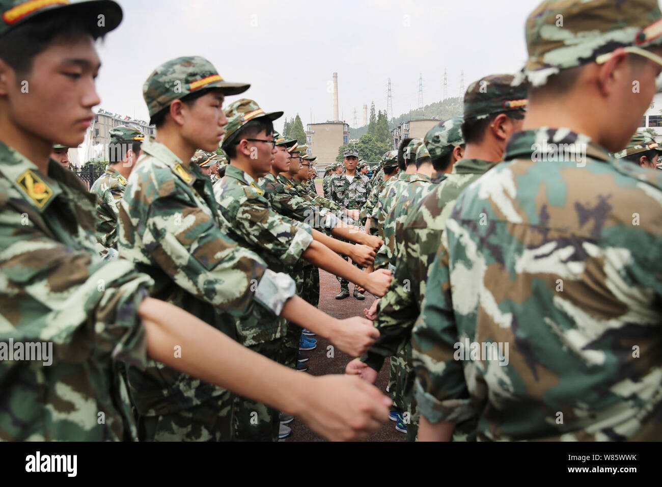 Young Chinese students take part in a military training session under ...