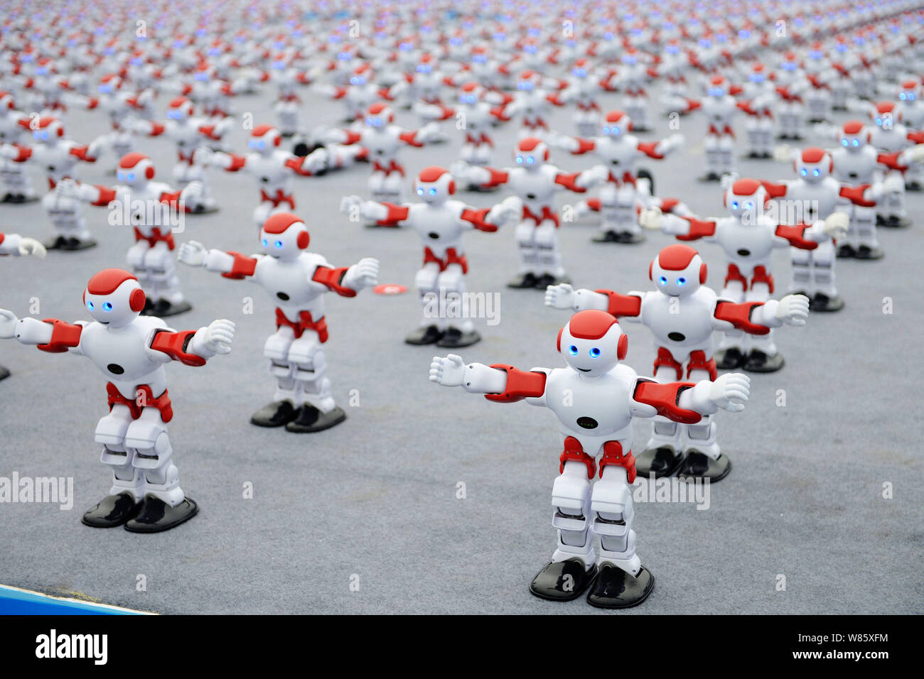 Robots dance during a challenge to set a new Guinness World Record for ...