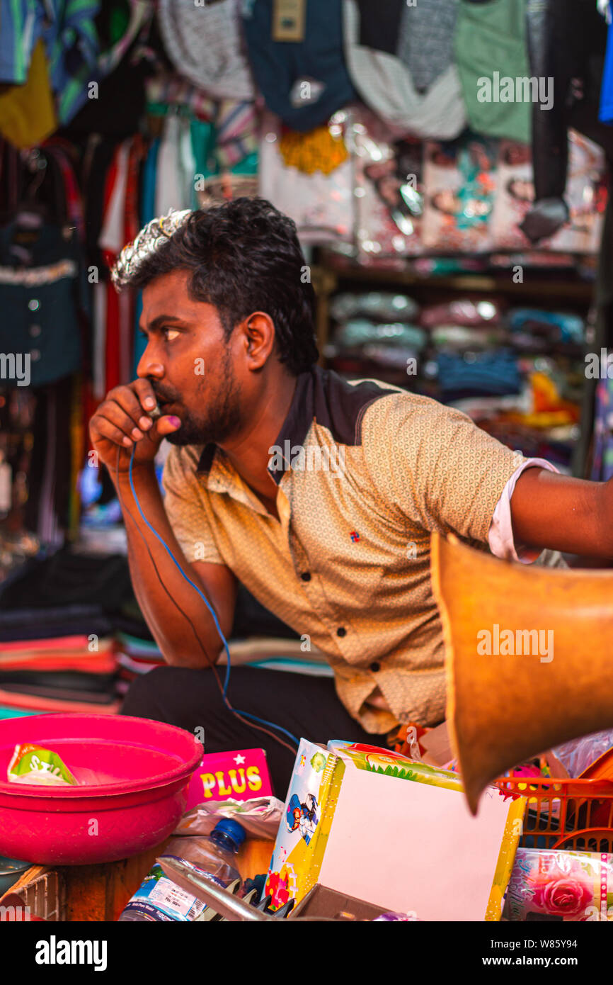 Local market salesman speaking with micro Stock Photo - Alamy
