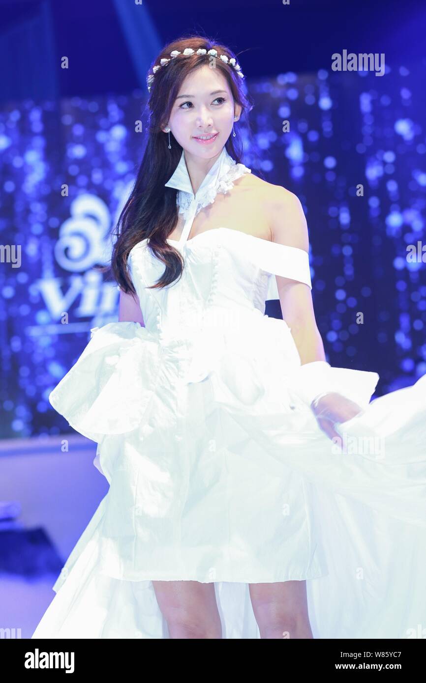 Taiwanese model and actress Lin Chi-ling clad in a paper dress attends ...