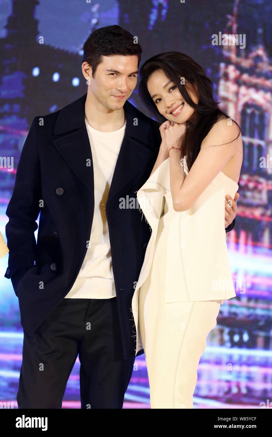 Taiwanese actress Shu Qi, right, poses at a press conference to promote ...