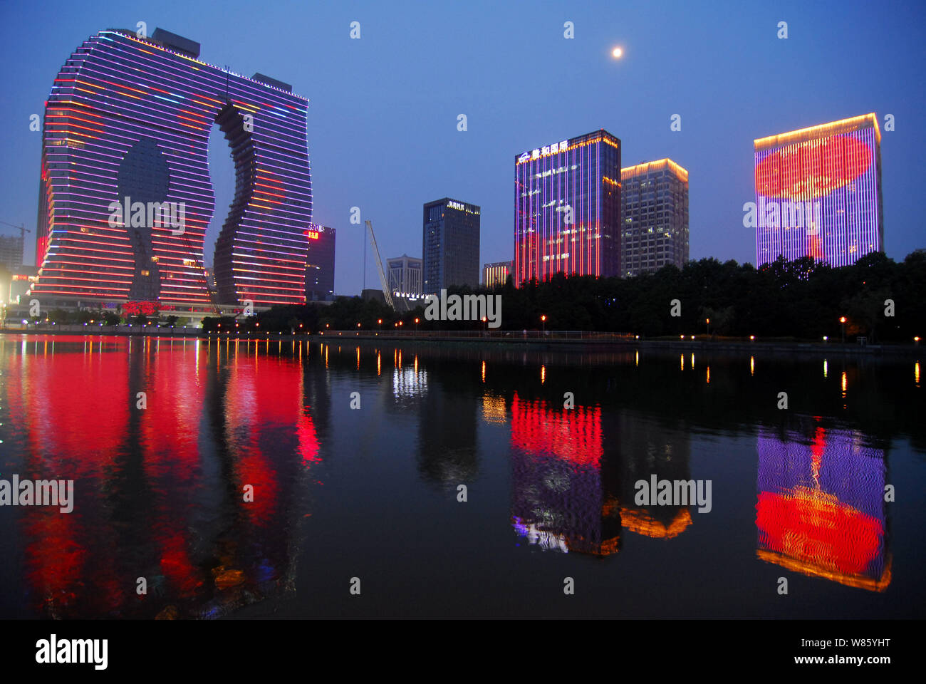 Night view of illuminated high-rise buildings in Hangzhou city, east ...