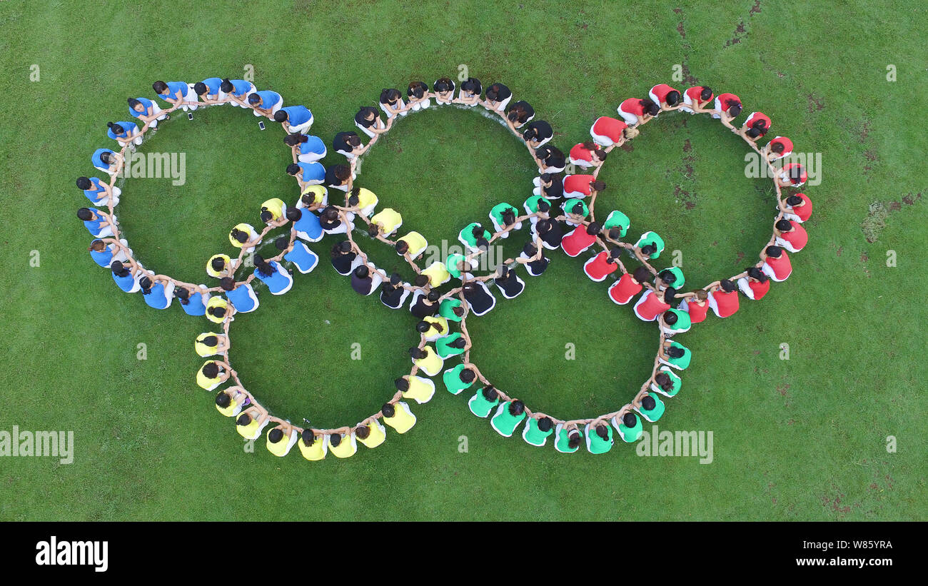 Female Chinese yoga lovers form the Olympic Rings to cheer for Chinese ...