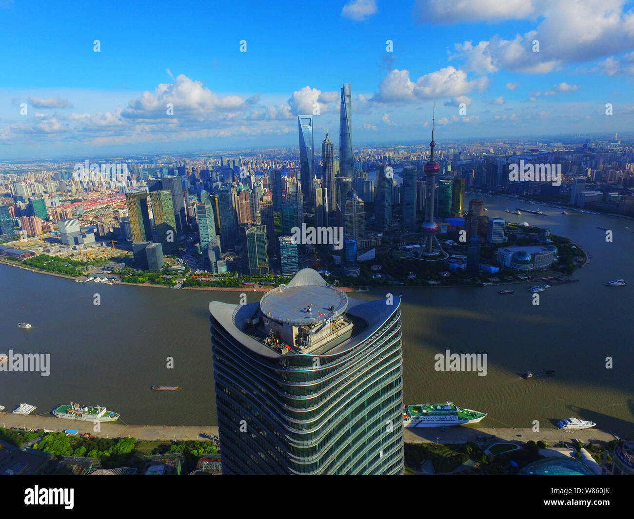 Skyline of the White Magnolia Plaza, front, in Puxi, Huangpu River and ...