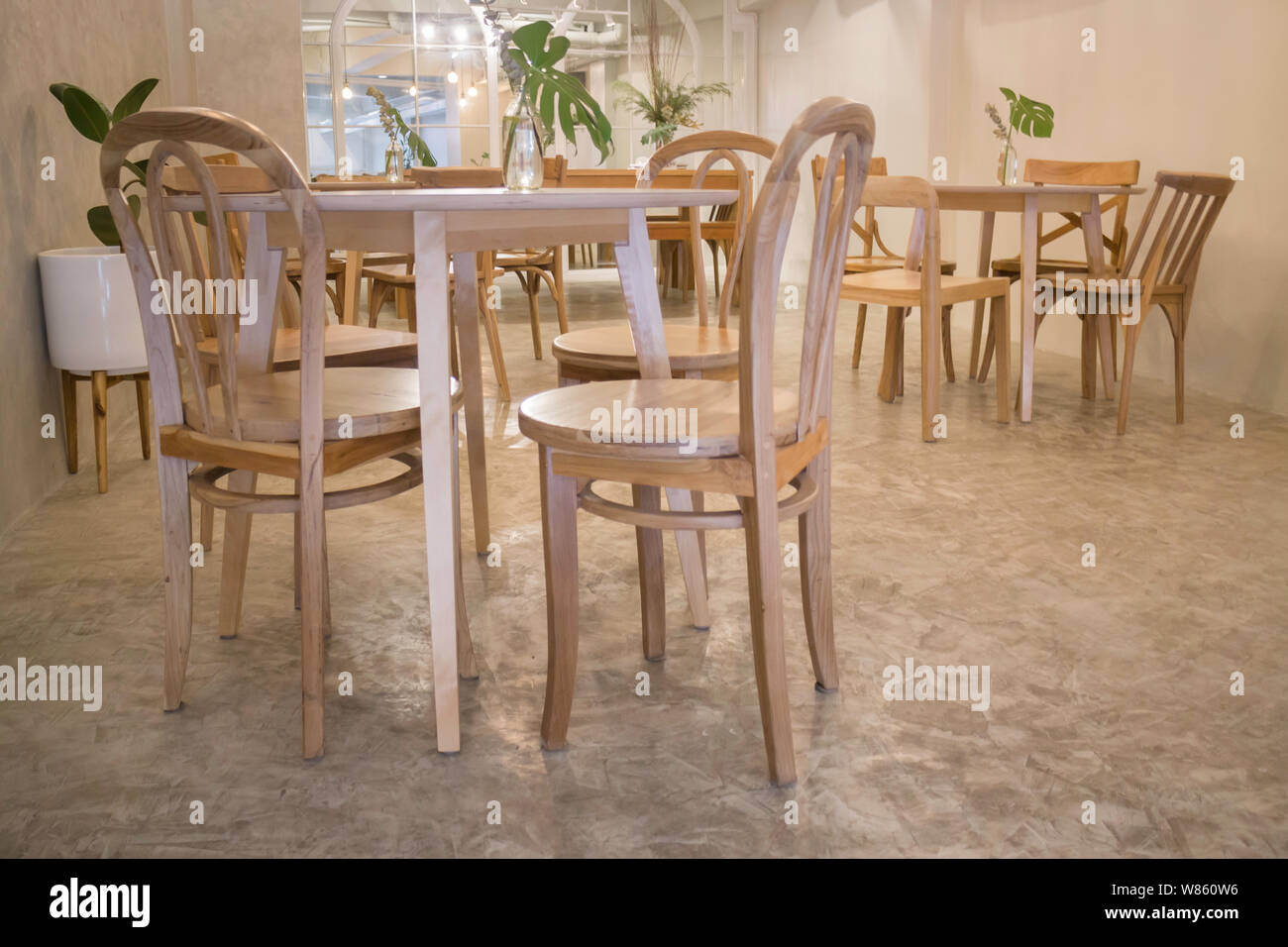 Cozy coffee shop with wooden furniture set, stock photo Stock Photo - Alamy