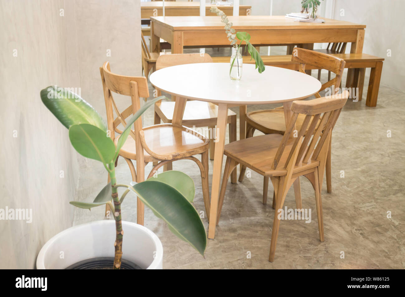 Cozy coffee shop with wooden furniture set, stock photo Stock Photo - Alamy