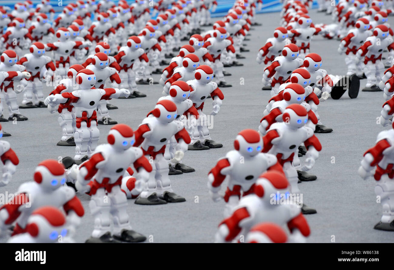 Robots dance during a challenge to set a new Guinness World Record for ...