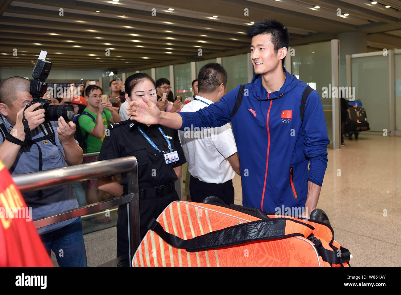 Chinese badminton player Chen Long, right, is pictured after coming ...