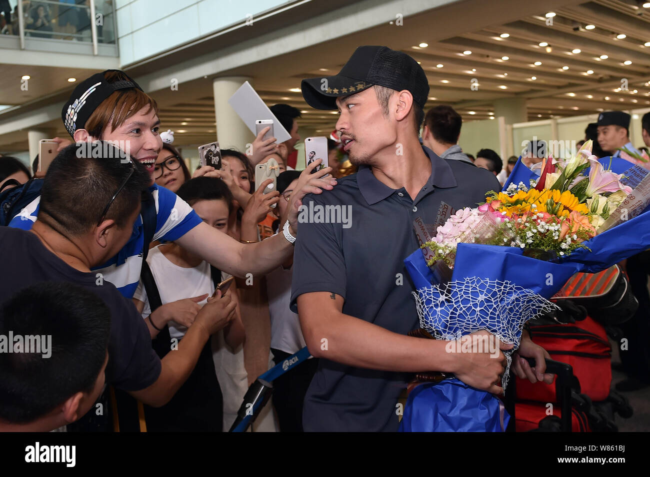 Chinese badminton player Lin Dan, right, is pictured after coming back ...