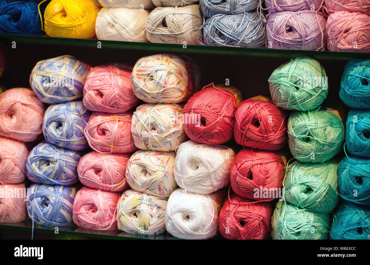 Colorful threads. Selection of colorful yarn wool on shopfront ...