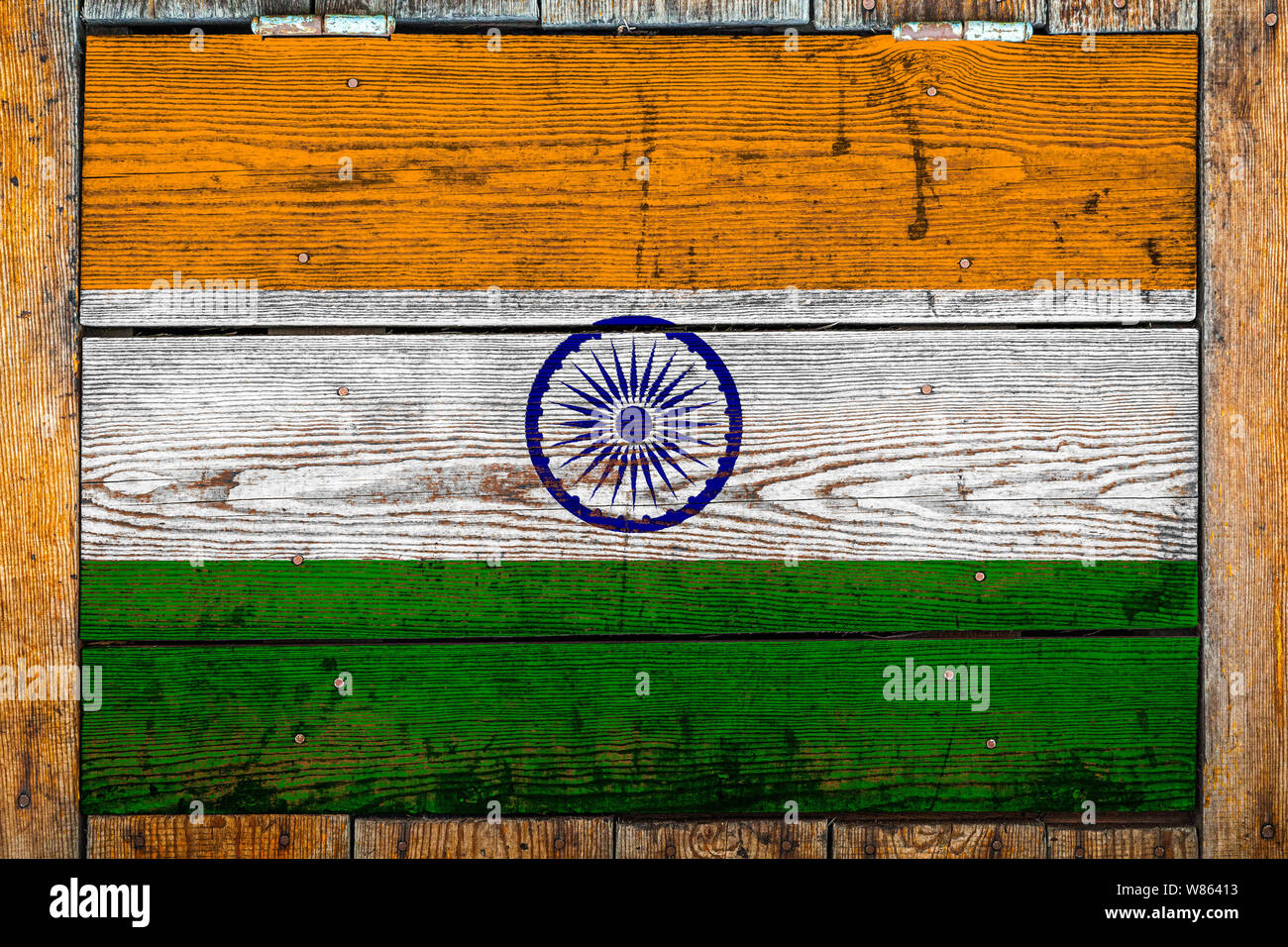 National flag of India on a wooden wall background.The concept of ...