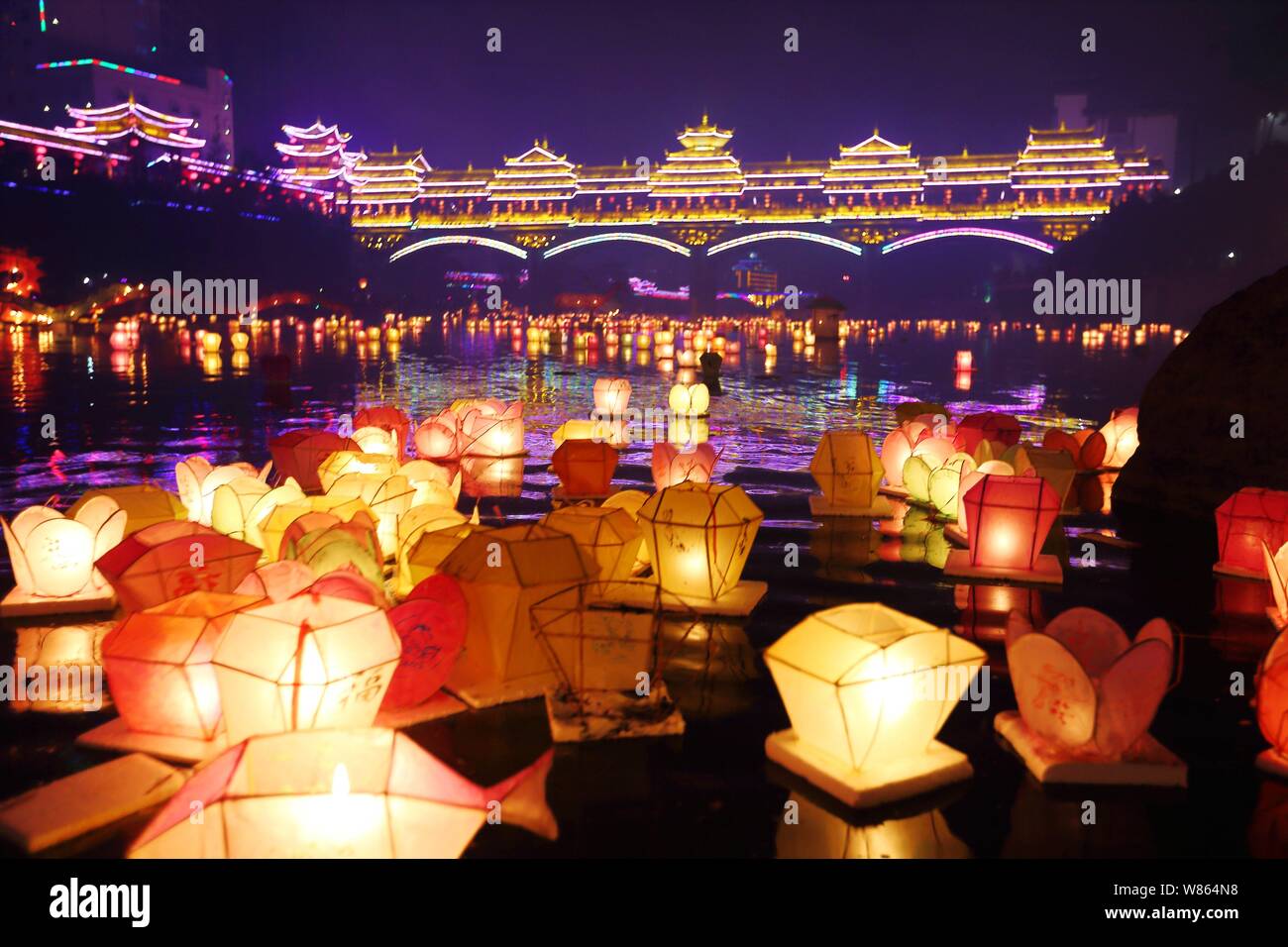 Lanterns float along the Zijiang River after released by local ...