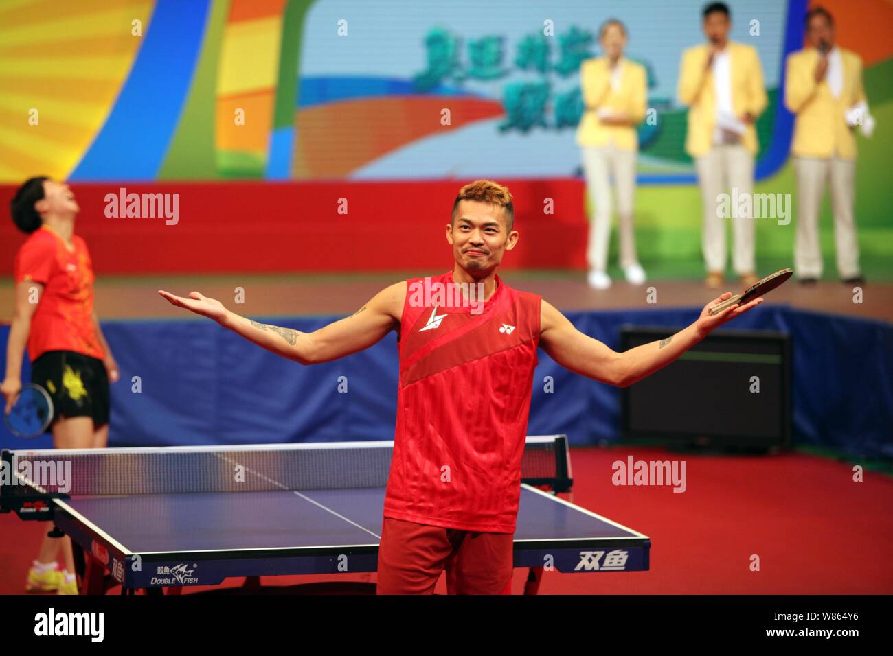 Chinese badminton star Lin Dan poses at a table tennis demonstration ...