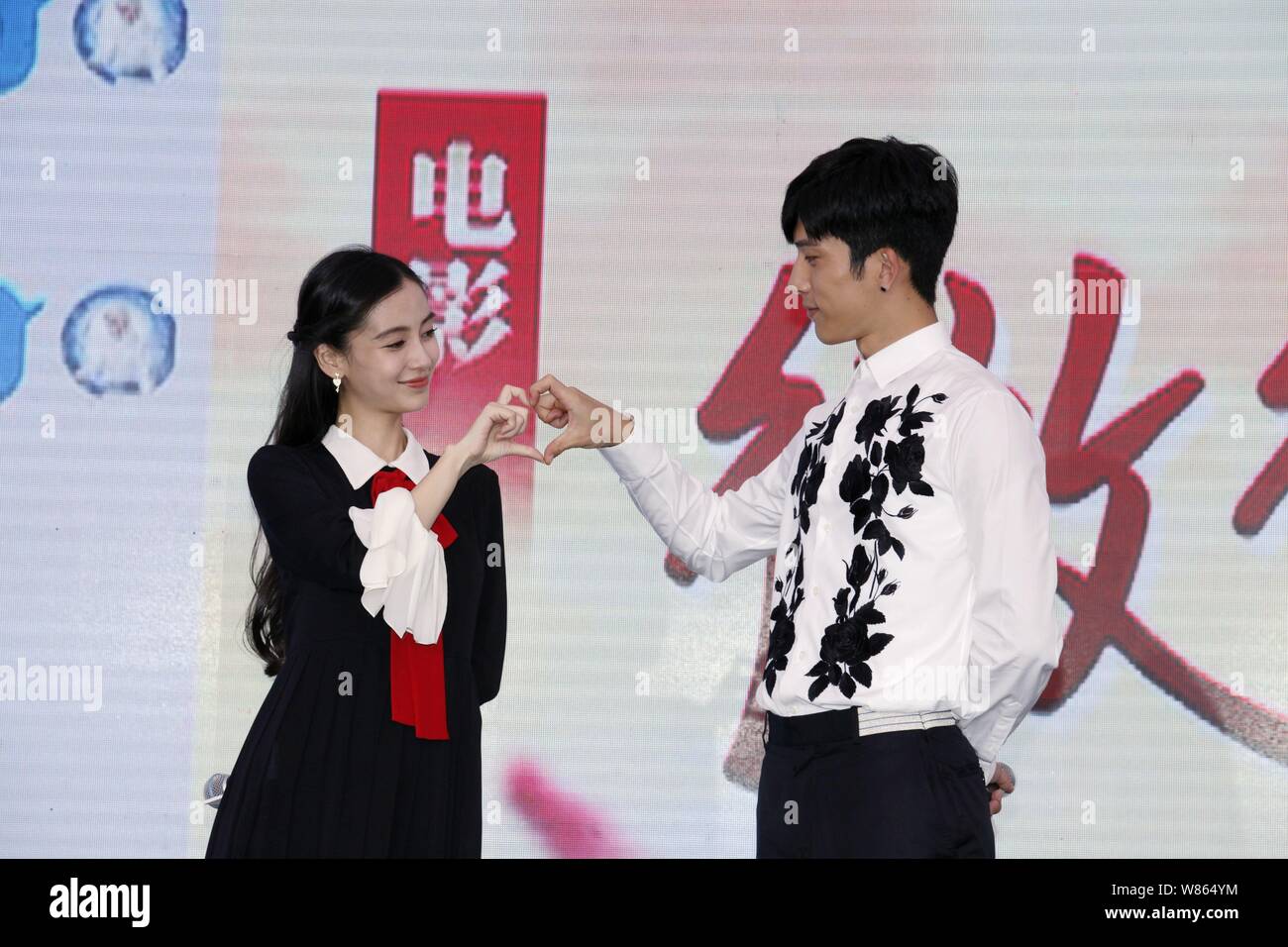 Hong Kong model and actress Angelababy, left, and Chinese actor Jing ...
