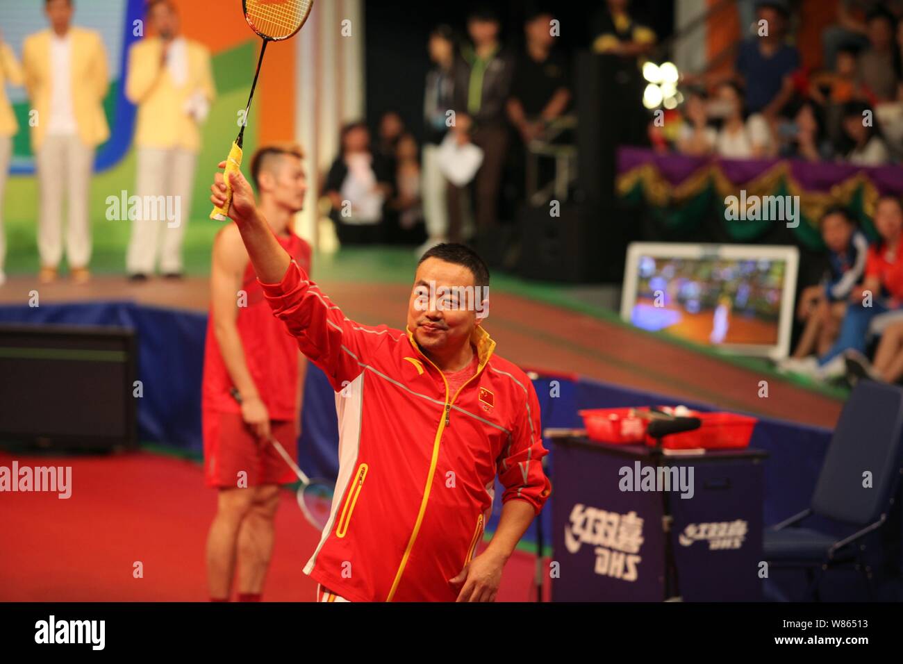 Liu Guoliang, coach of China's national table tennis team, waves at a ...