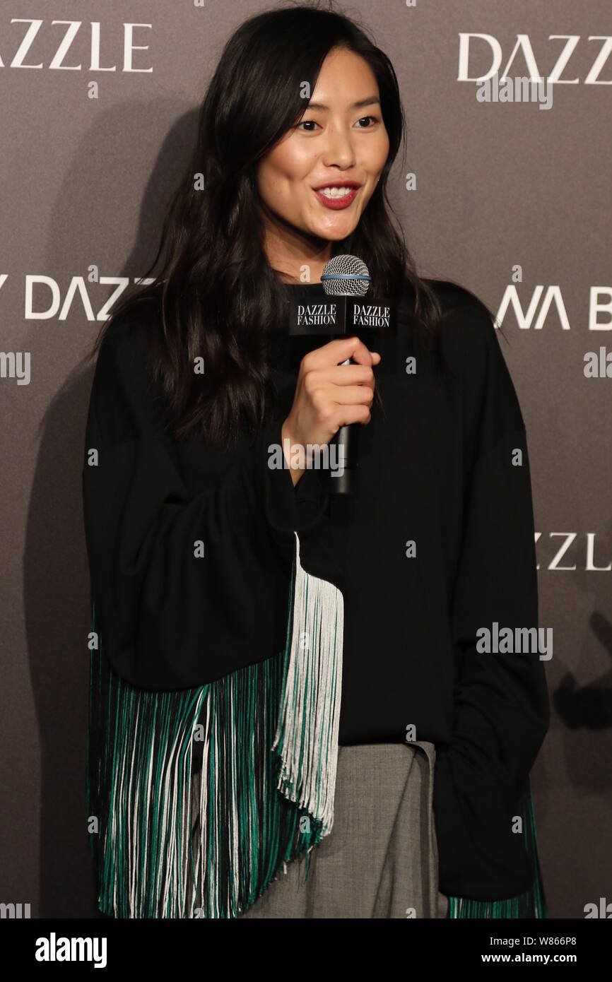 Chinese super model Liu Wen speaks at a fashion show of "DAZZLE" in ...