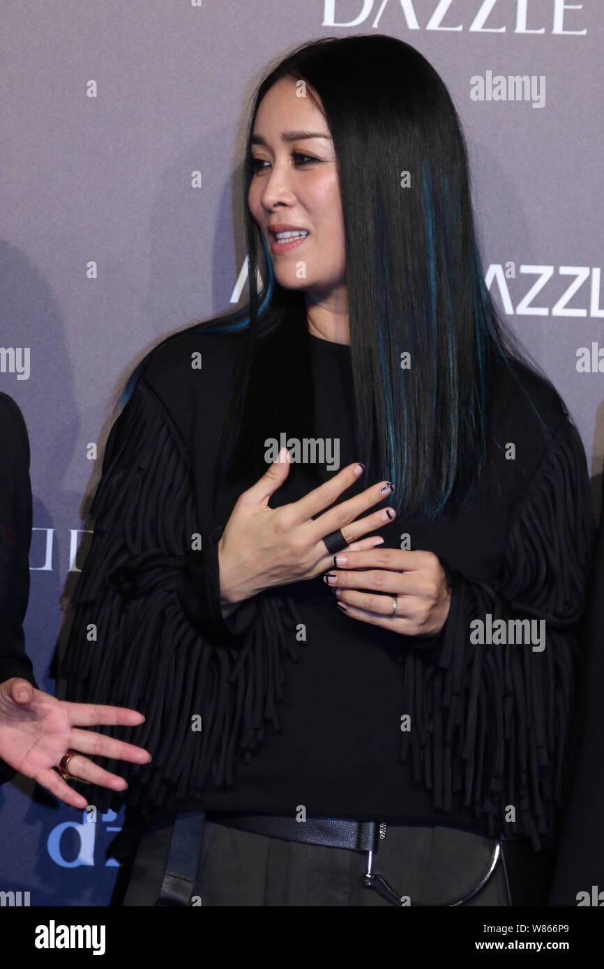 Chinese singer Na Ying poses at a fashion show of "DAZZLE" in Shanghai ...