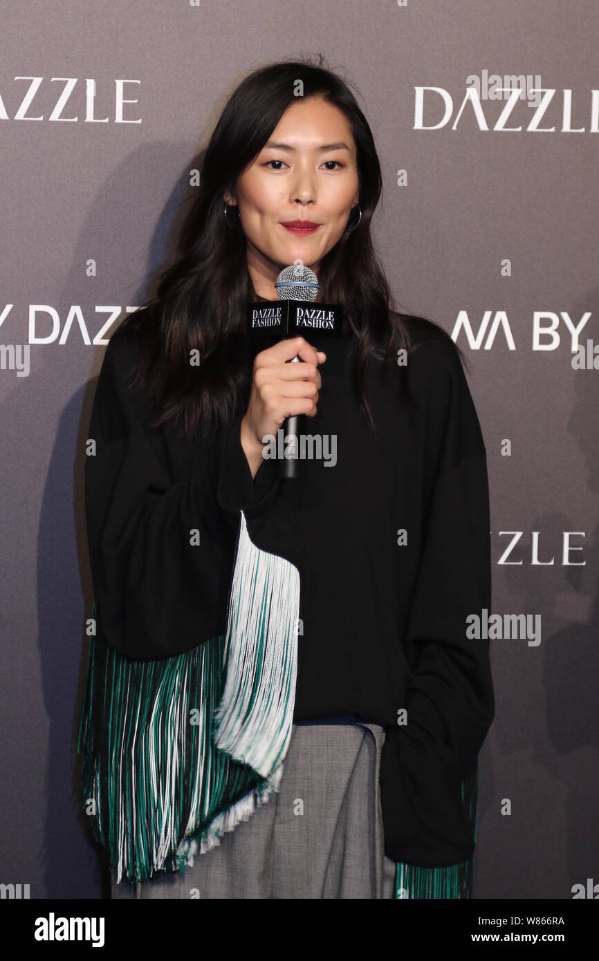 Chinese super model Liu Wen speaks at a fashion show of "DAZZLE" in ...