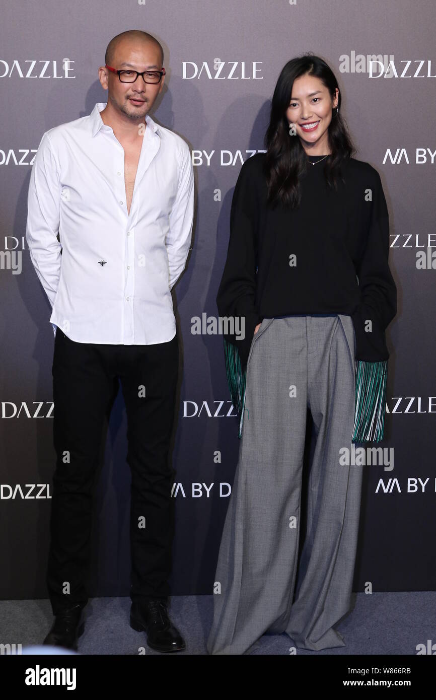 Chinese super model Liu Wen, right, poses at a fashion show of "DAZZLE ...