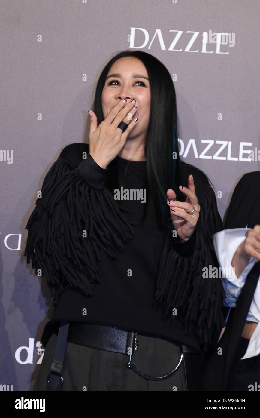 Chinese singer Na Ying poses at a fashion show of "DAZZLE" in Shanghai ...